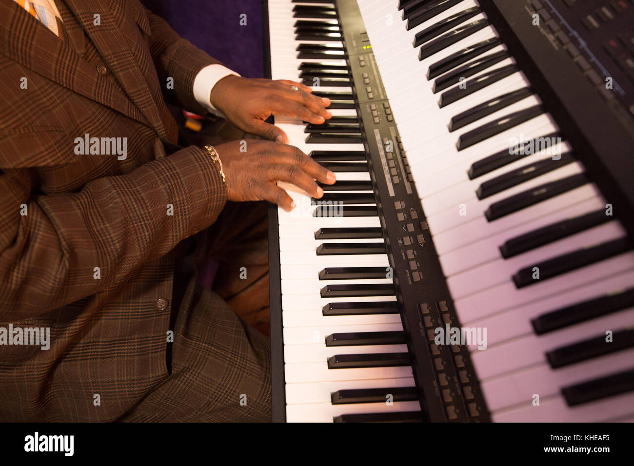 Man in suit playing keyboard hi-res stock photography and images - Alamy