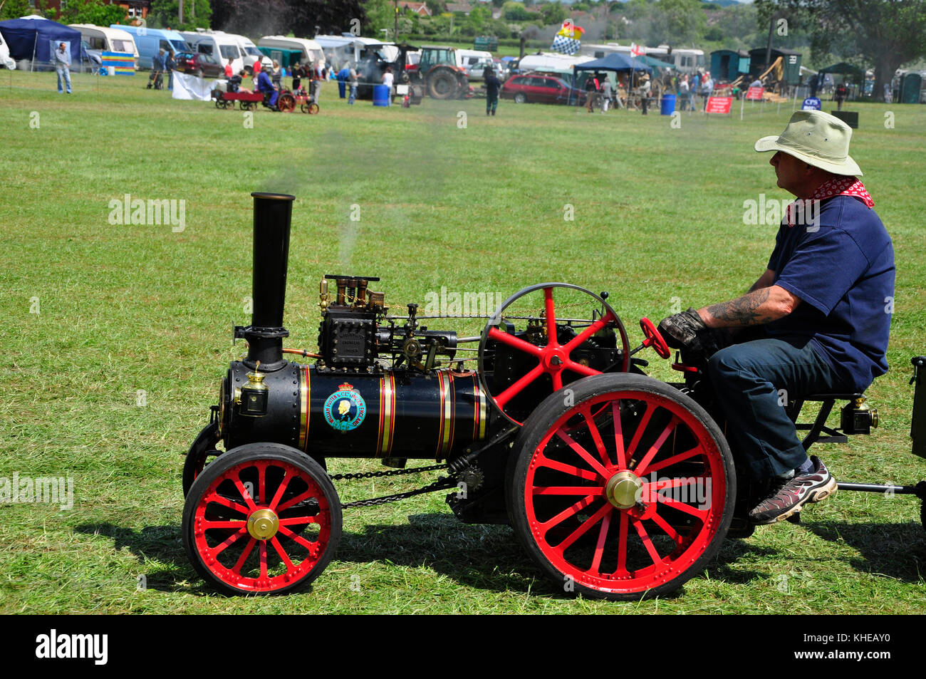 Miniature steam traction engine being displayed at a country show ...