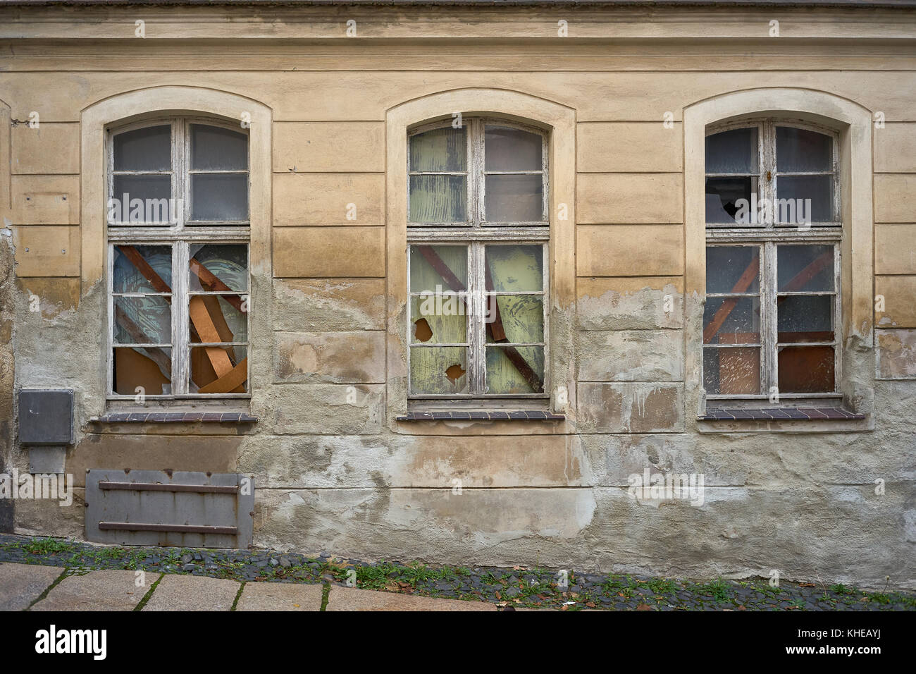 Broken and boarded-up windows in an old abandoned house in Germany Stock Photo - Alamy