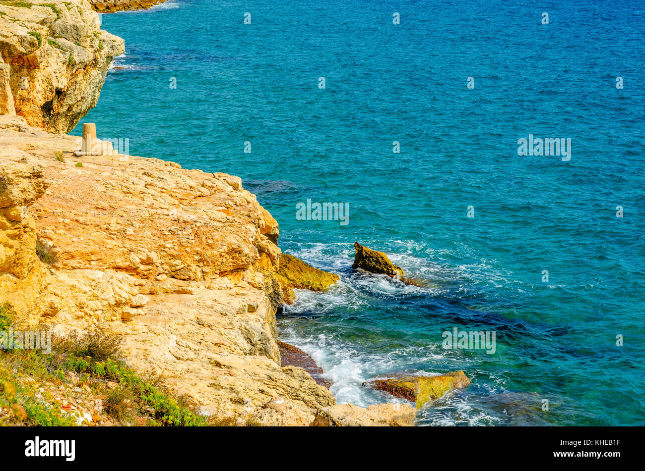 high cliff above the sea, summer sea background, many splashing waves ...