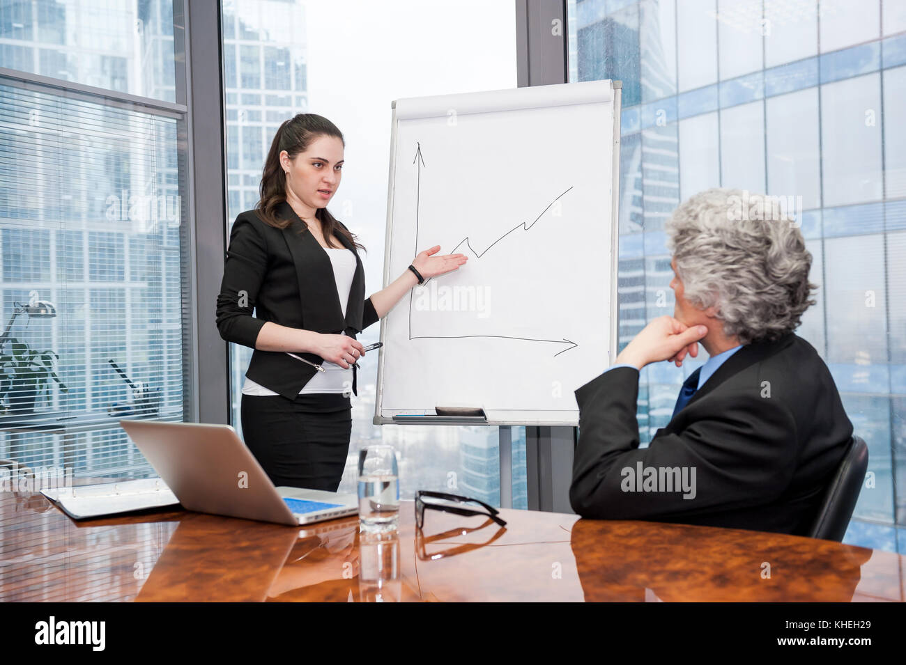 Young business woman making a presentation Stock Photo - Alamy