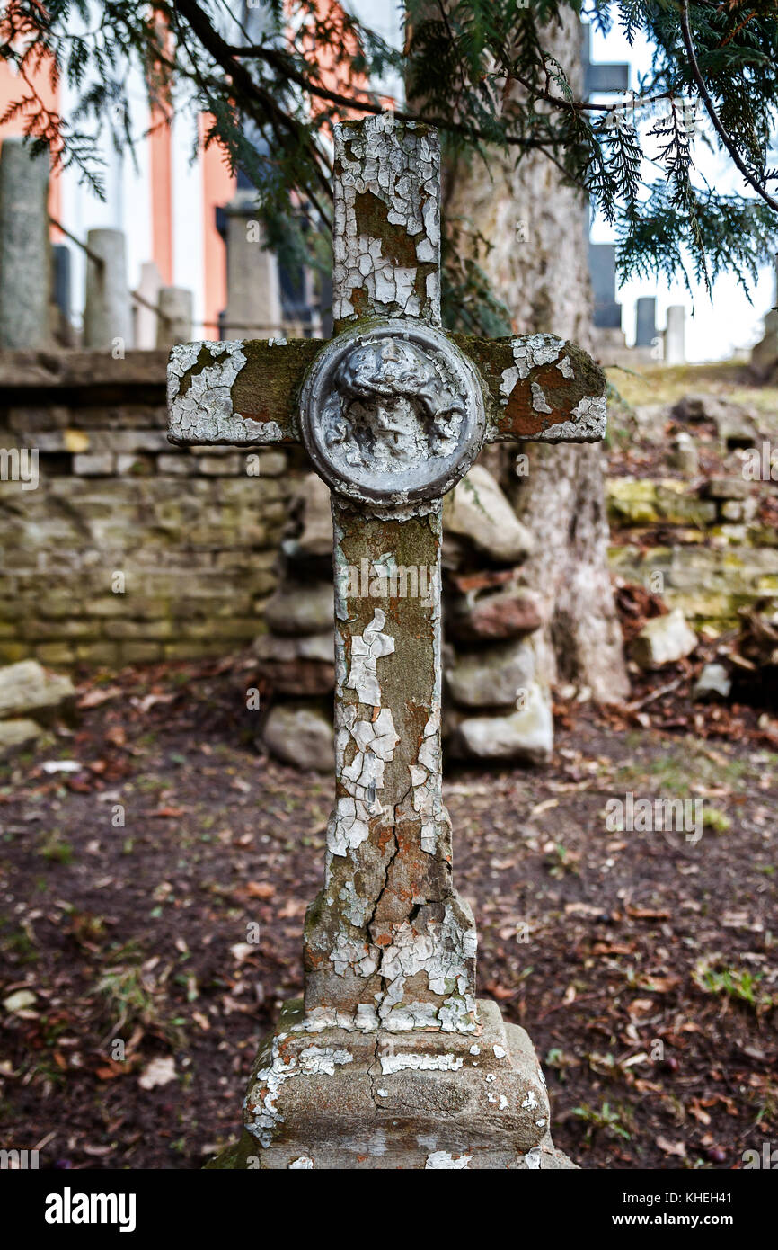 Old Christian cross made of concrete in the Rasos cemetery in Vilnius ...