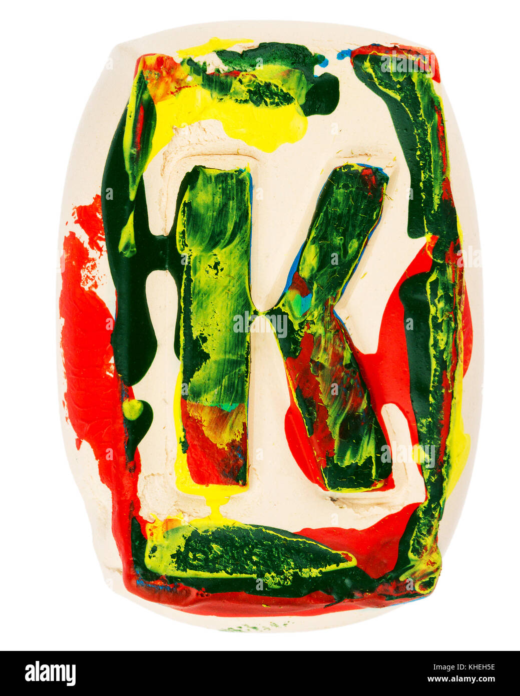 Handmade of white clay letter K painted with colorful acrylic paints ...