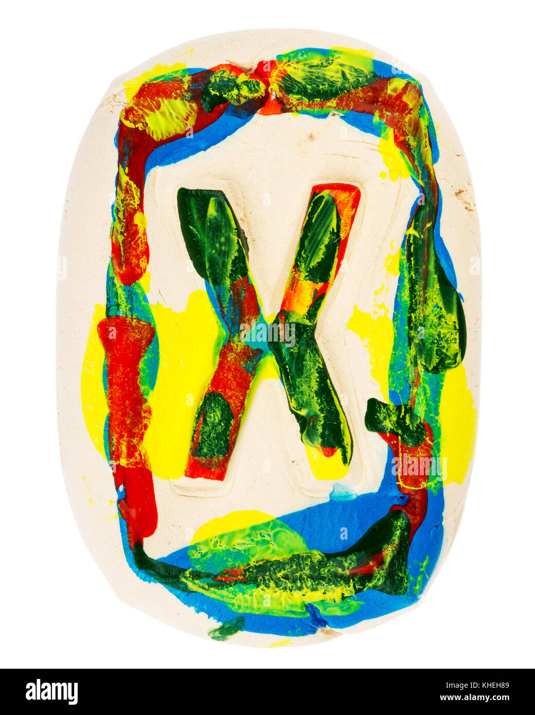 Handmade of white clay letter X painted with colorful acrylic paints ...
