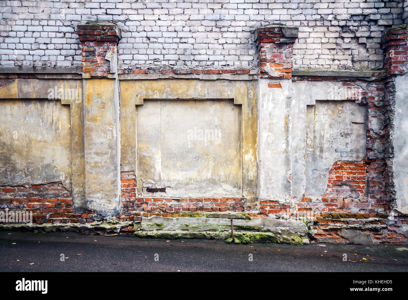 Old weathered wall of bricks and a ground Stock Photo - Alamy