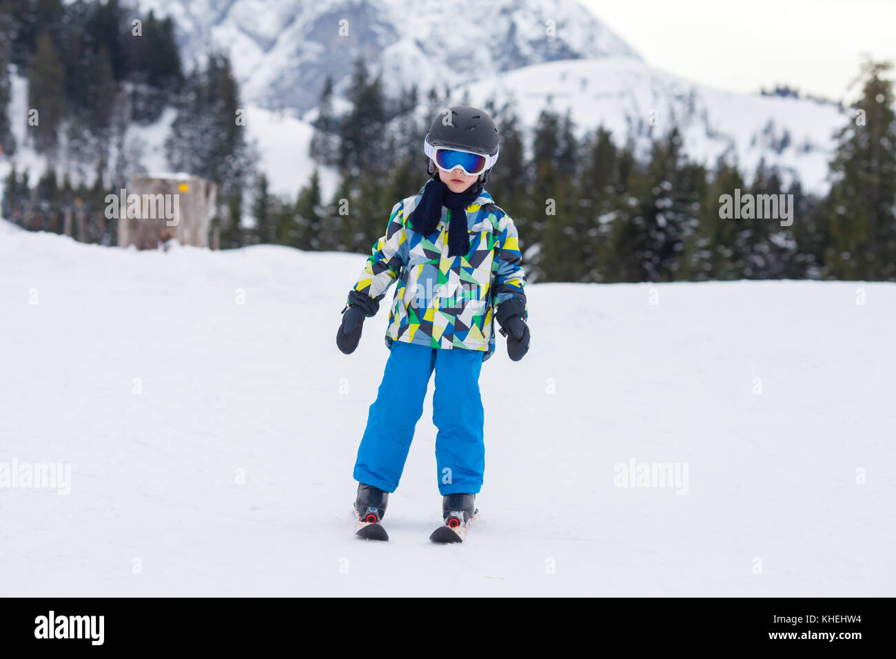 Young preschool child, skiing on snow slope in ski resort in Austria ...