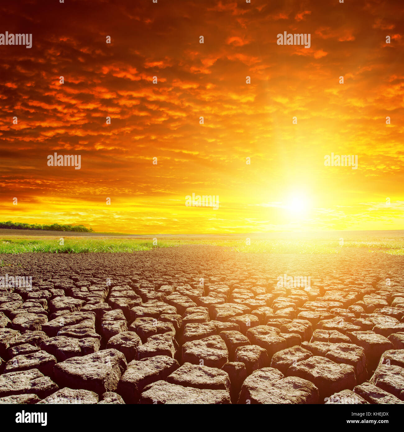 cracked earth and red sunset Stock Photo - Alamy