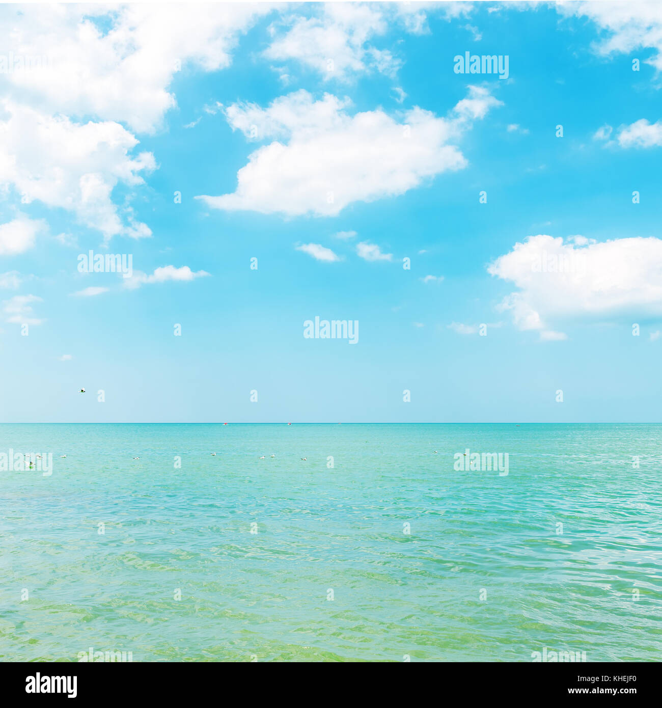 azure color sea and cloudy sky Stock Photo - Alamy