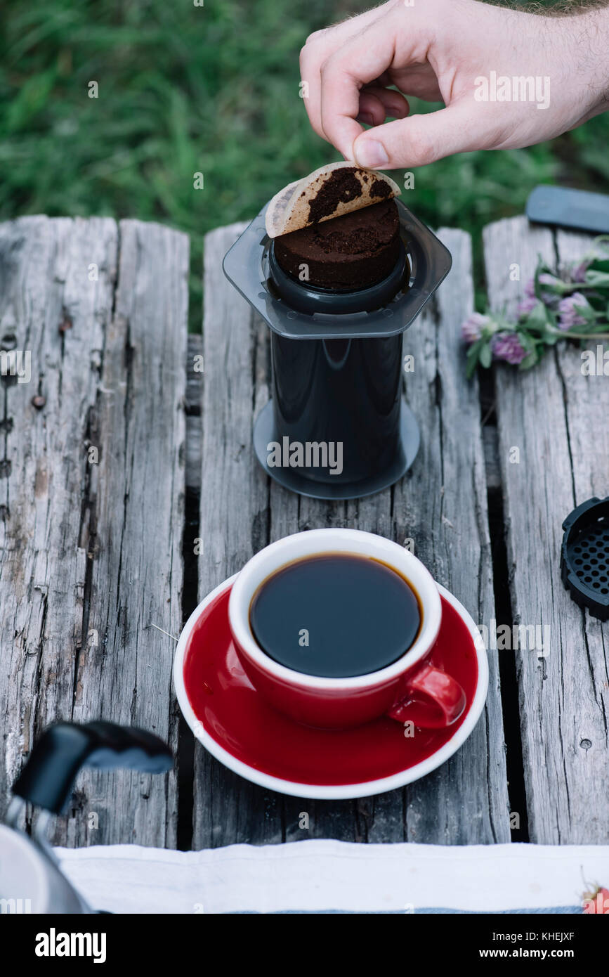 Fresh coffee puck, left from making filter coffee outdoors on the ...