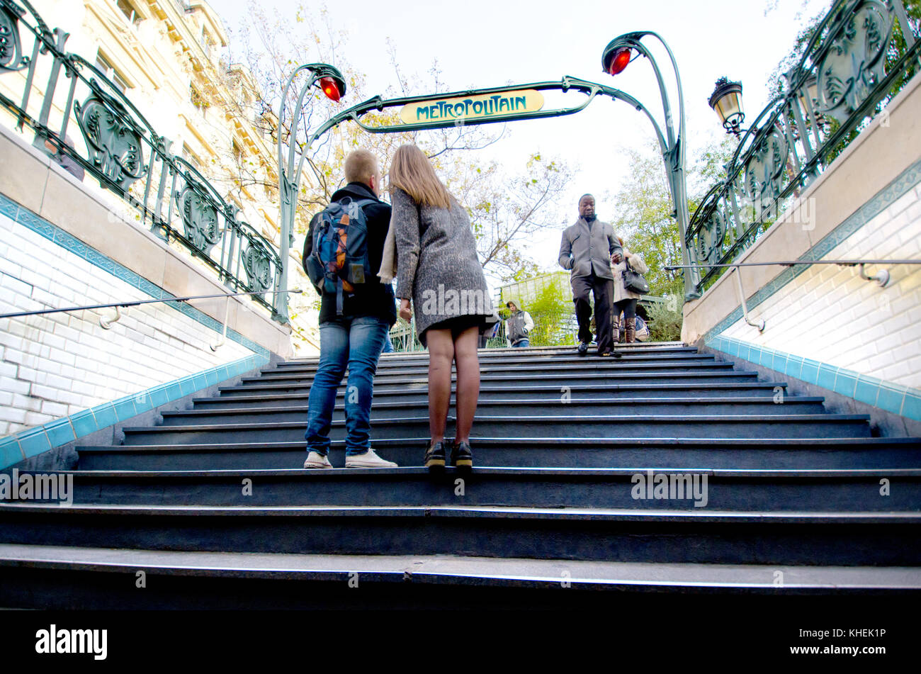 Paris, France. Paris Metro. Young couple on the steps up Stock Photo ...