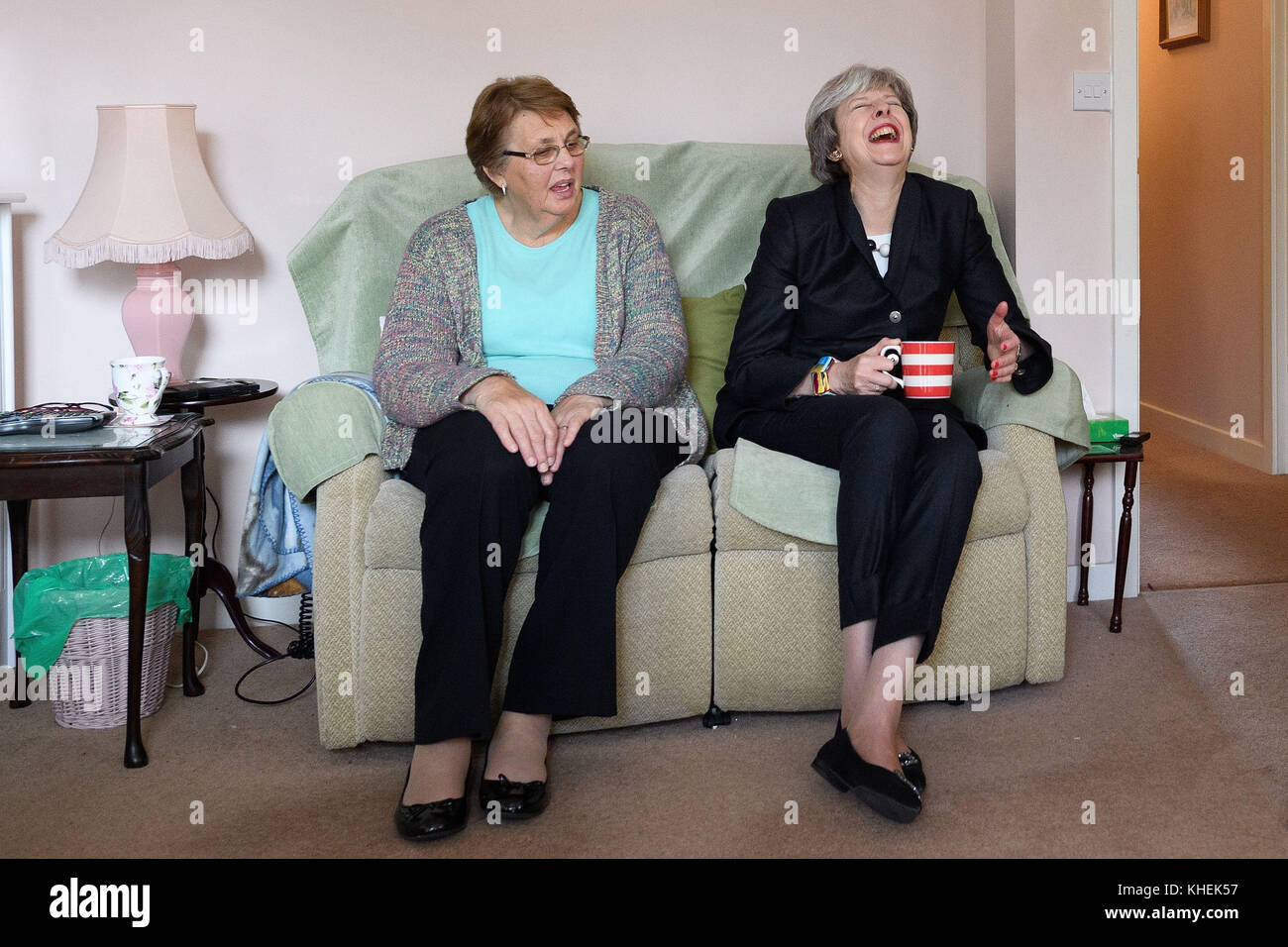 Prime Minister Theresa May meets resident Val Lay (left) during a visit ...