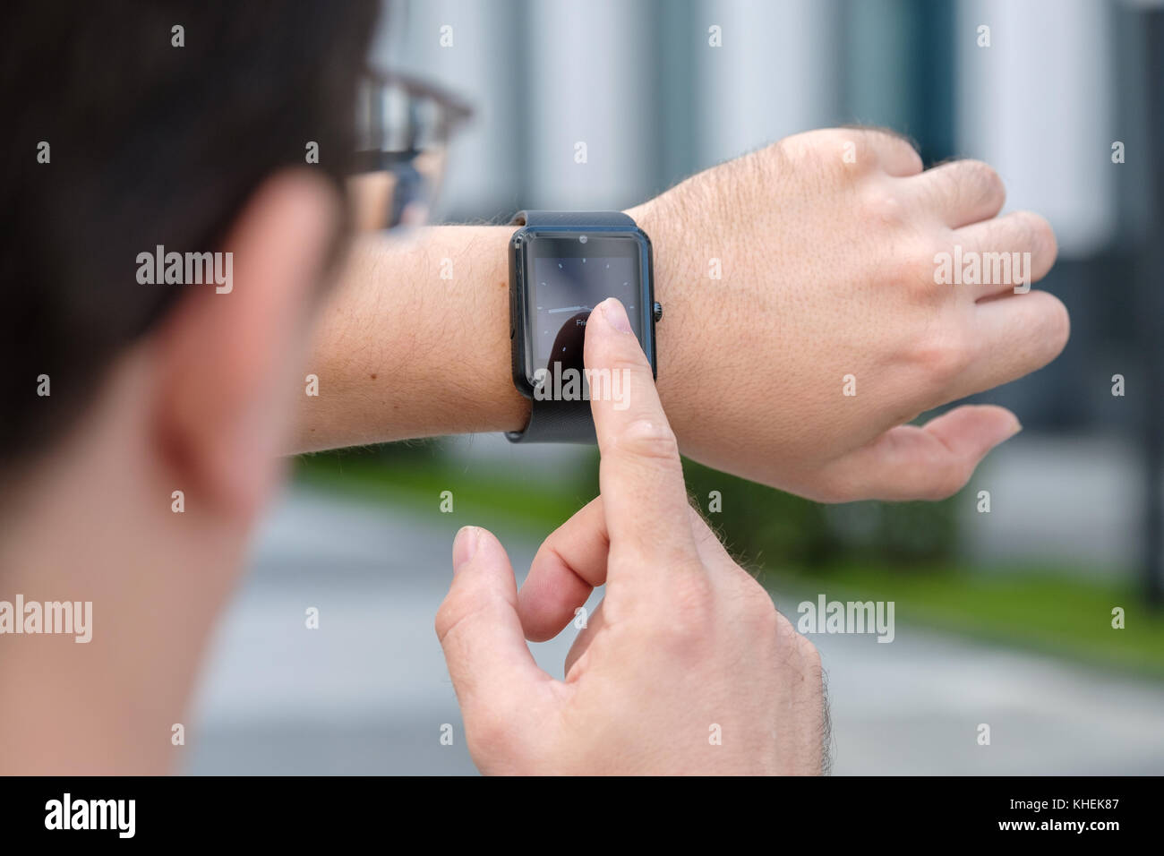 Man using smart watch Stock Photo - Alamy