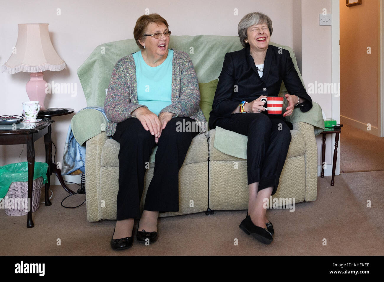 Prime Minister Theresa May meets resident Val Lay (left) during a visit ...
