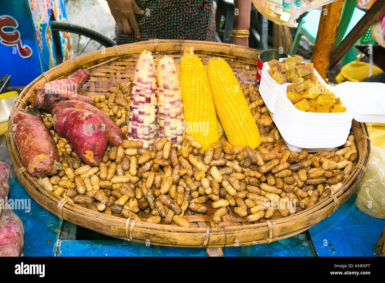 Asian cook prepares traditional steem Burmese street food in Yangon ...