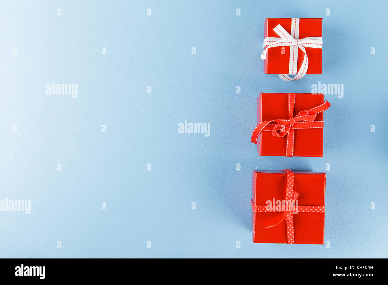 Christmas red box gifts and on blue background. Flat lay. Top view ...