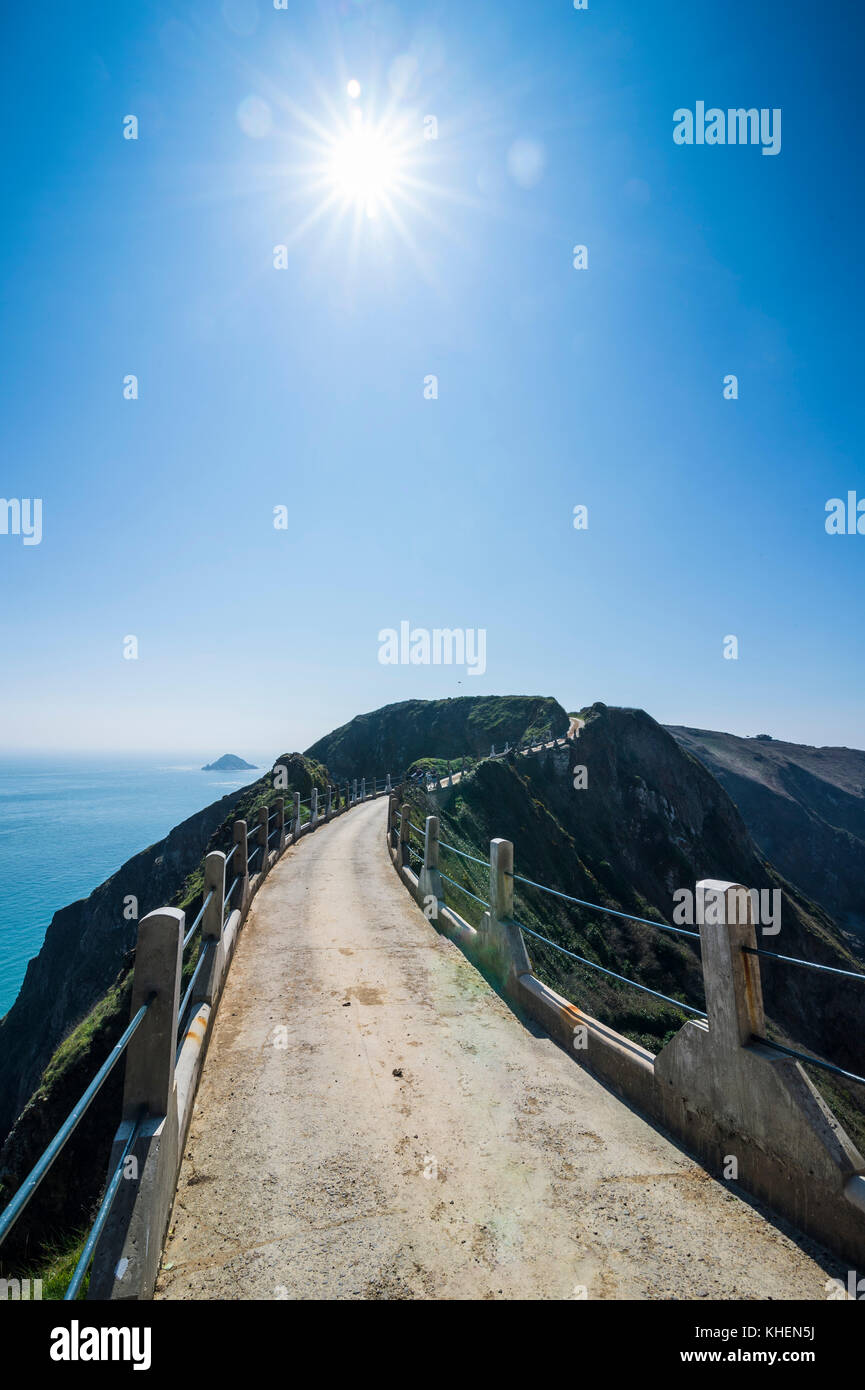 Road connecting the narrow isthmus of Greater and Little Sark, Channel ...