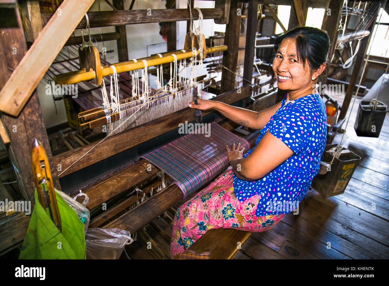 INLE, MYANMAR - MARCH 4 2017: Woman weaving with a loom in water ...