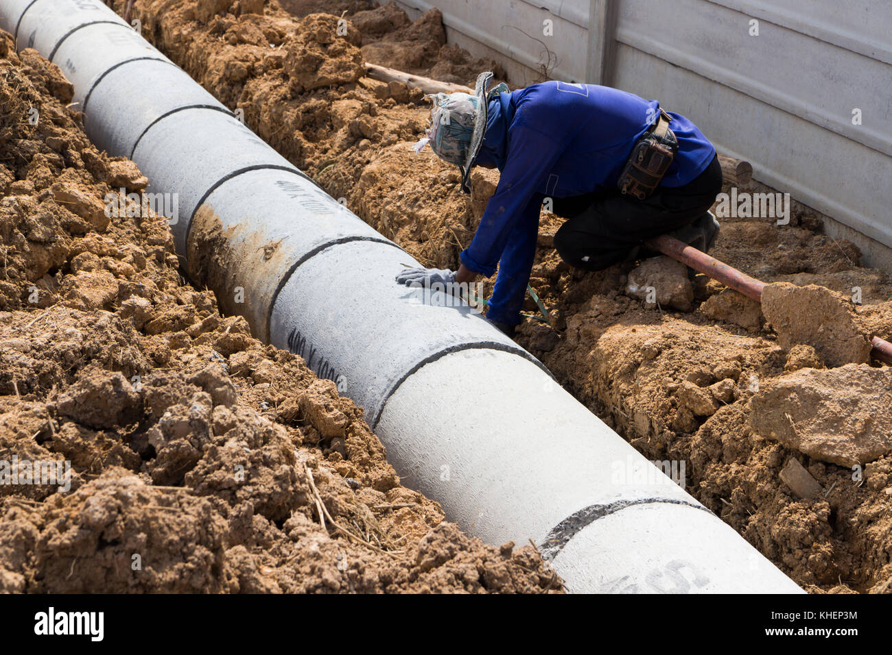 Worker install Precast concrete manholes ; for draining storm water ...