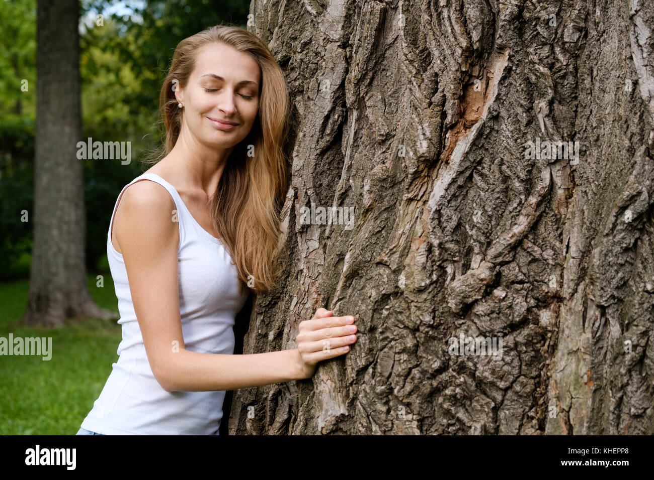 Environmentalist hugging tree hi-res stock photography and images - Alamy