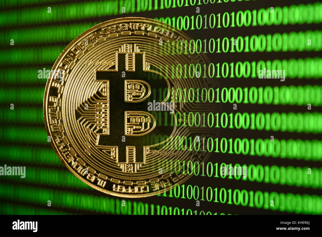 Symbol image digital currency, gold physical coin Bitcoin disappears in digital binary code ...