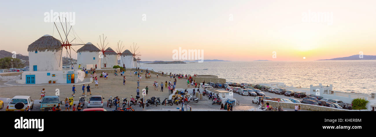 tourists watching the sunset from the windmills of mykonos island,,June ...