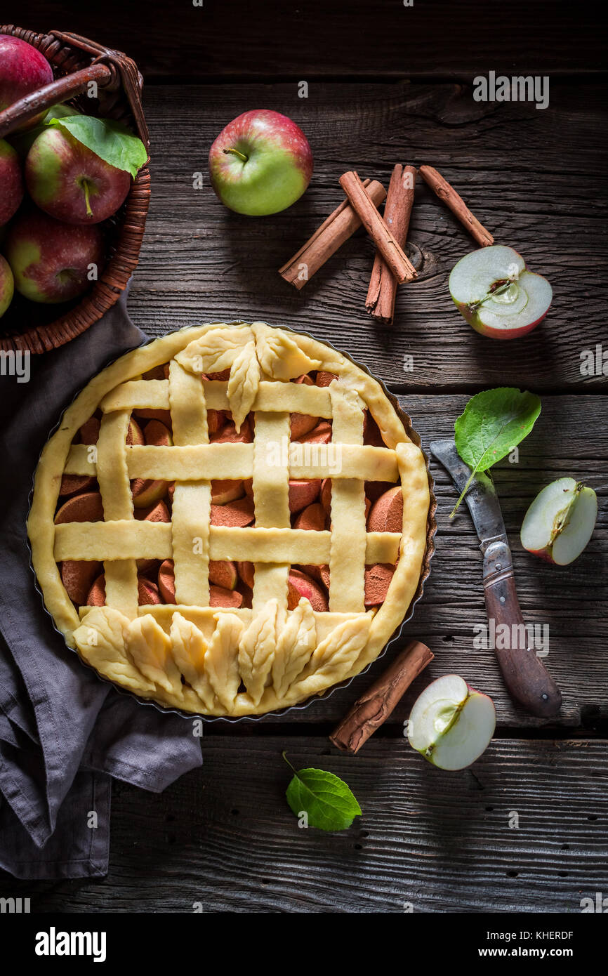 Rustic apple pie with cinnamon and fresh fruits Stock Photo - Alamy