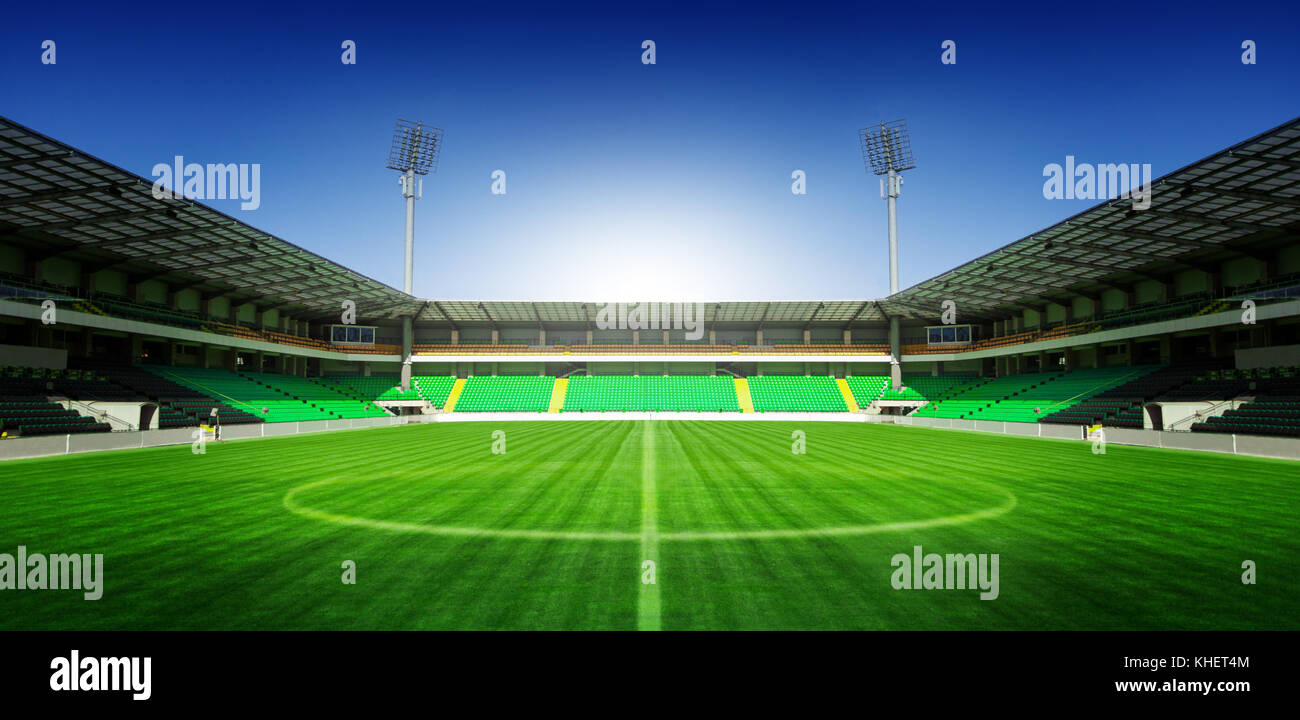 Soccer Football stadium with blue sky, setting sun Stock Photo - Alamy