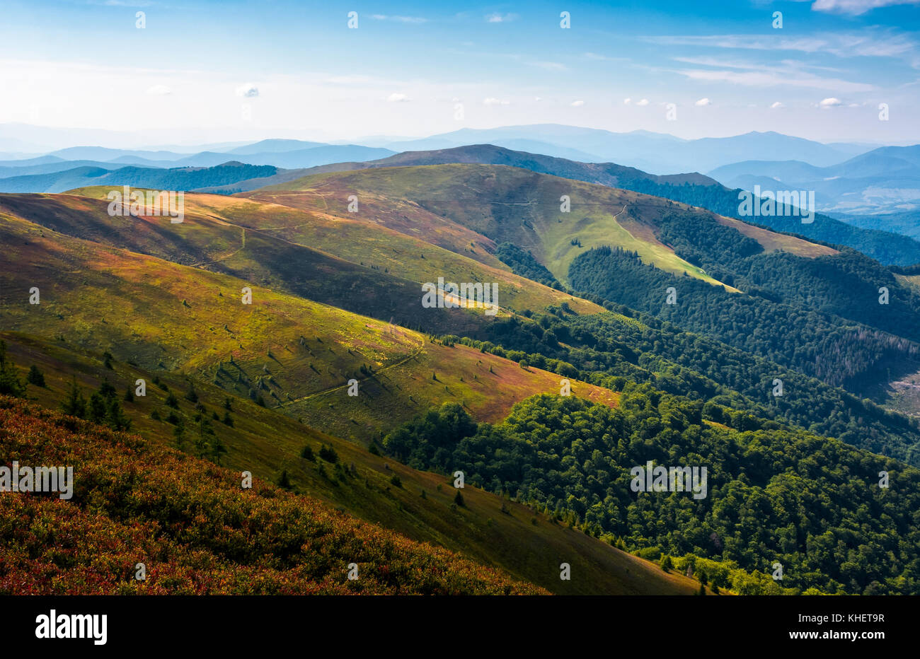 rolling hills of mountain ridge in late summer afternoon. colorful ...