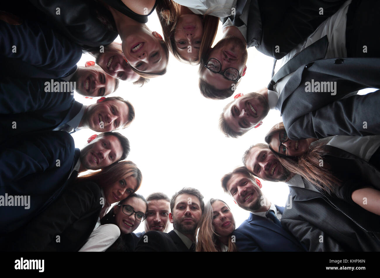 large business team is forming a circle and looking at the camera Stock ...