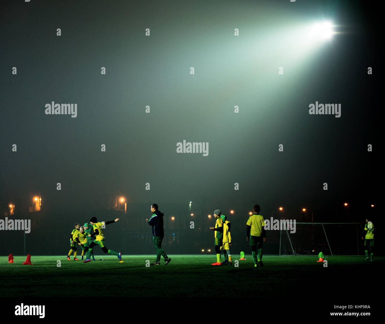 football team trains in the stadium at night Stock Photo - Alamy