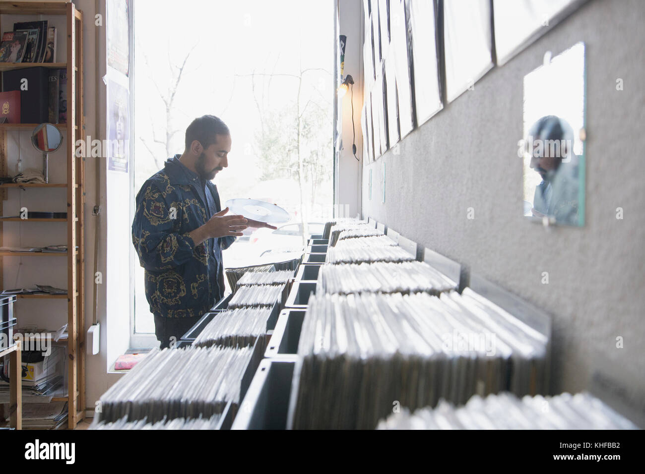 Young man shopping for records Stock Photo - Alamy