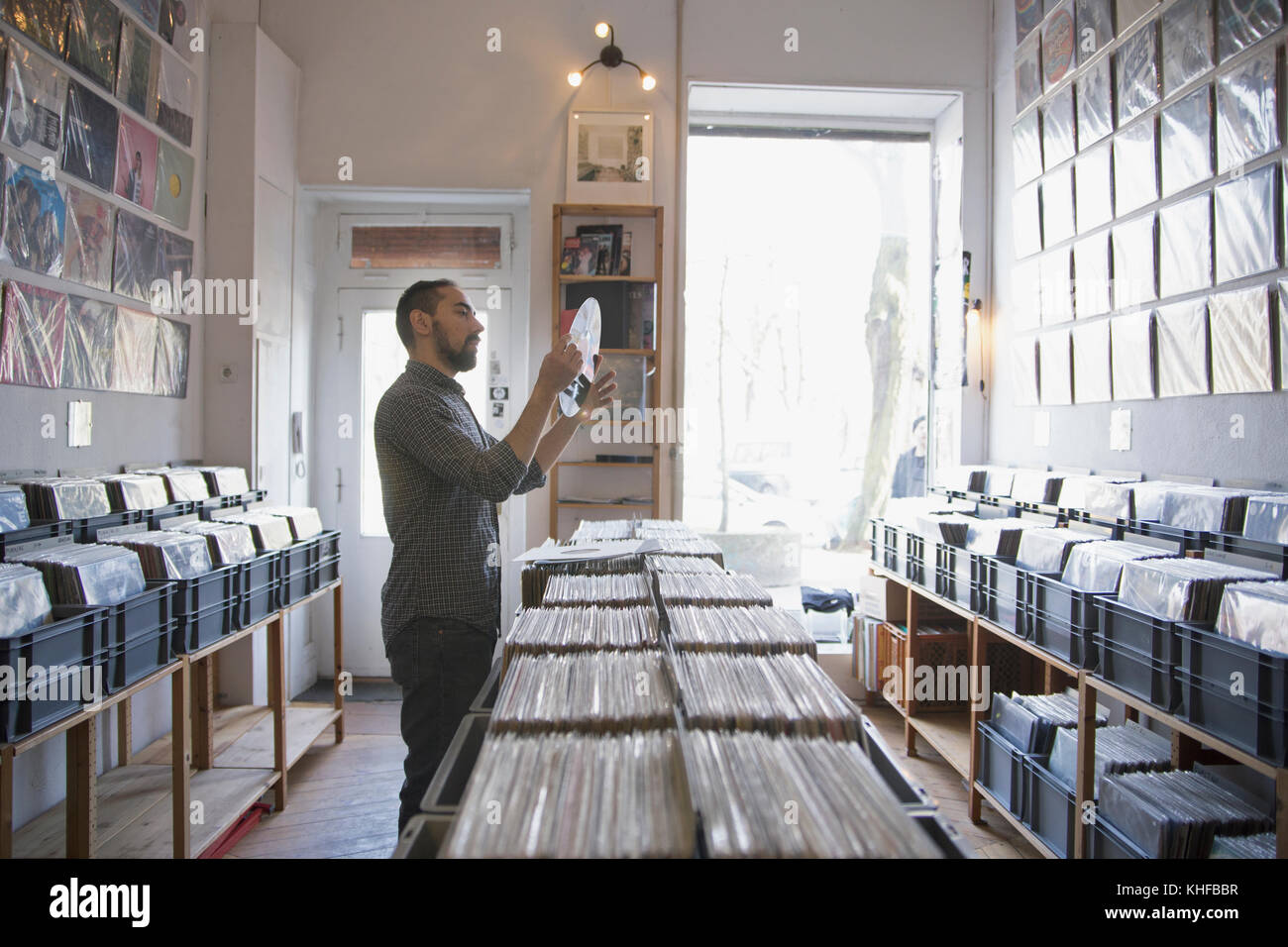 Young man shopping for records Stock Photo - Alamy
