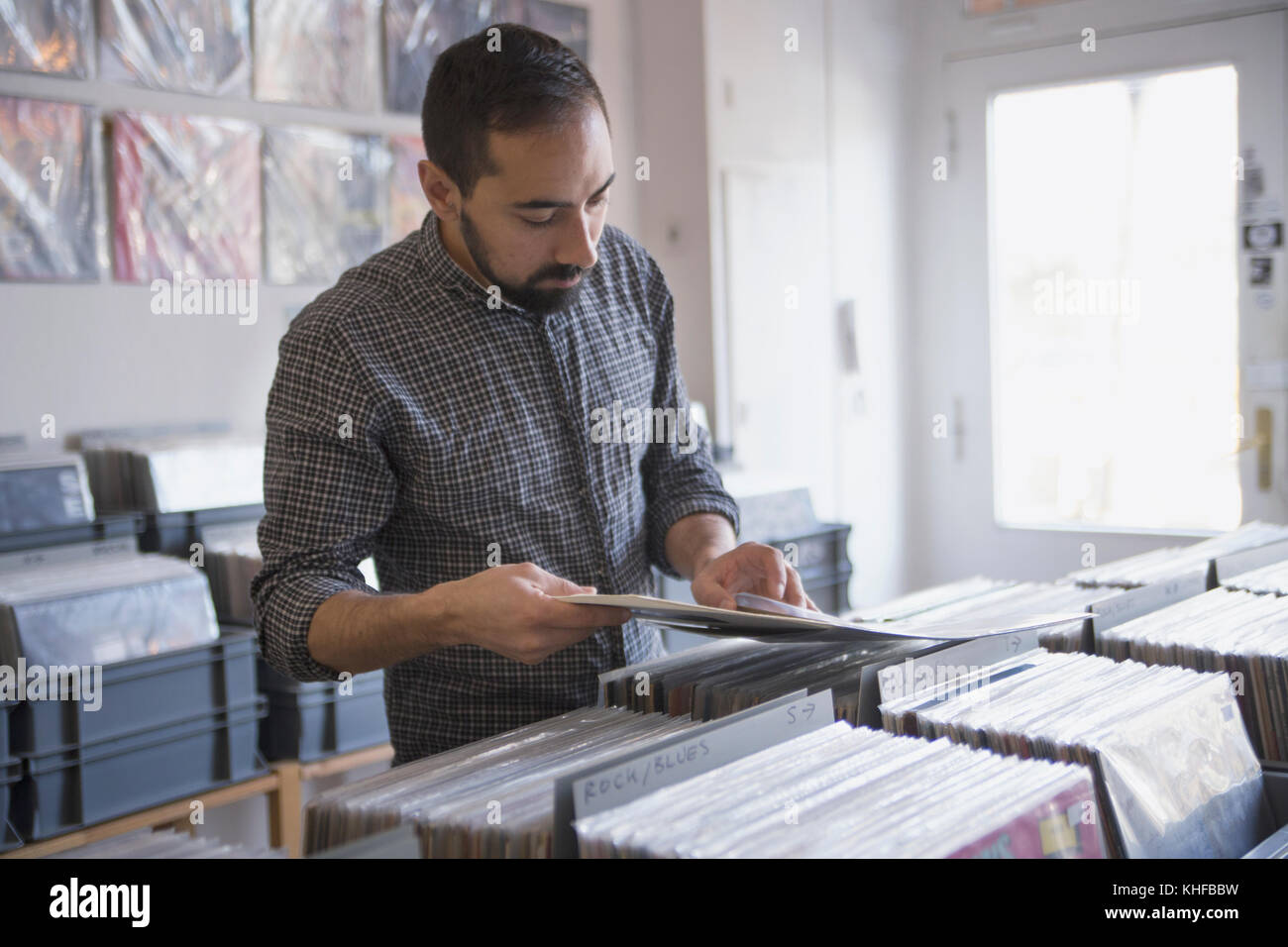 Young man shopping for records Stock Photo - Alamy