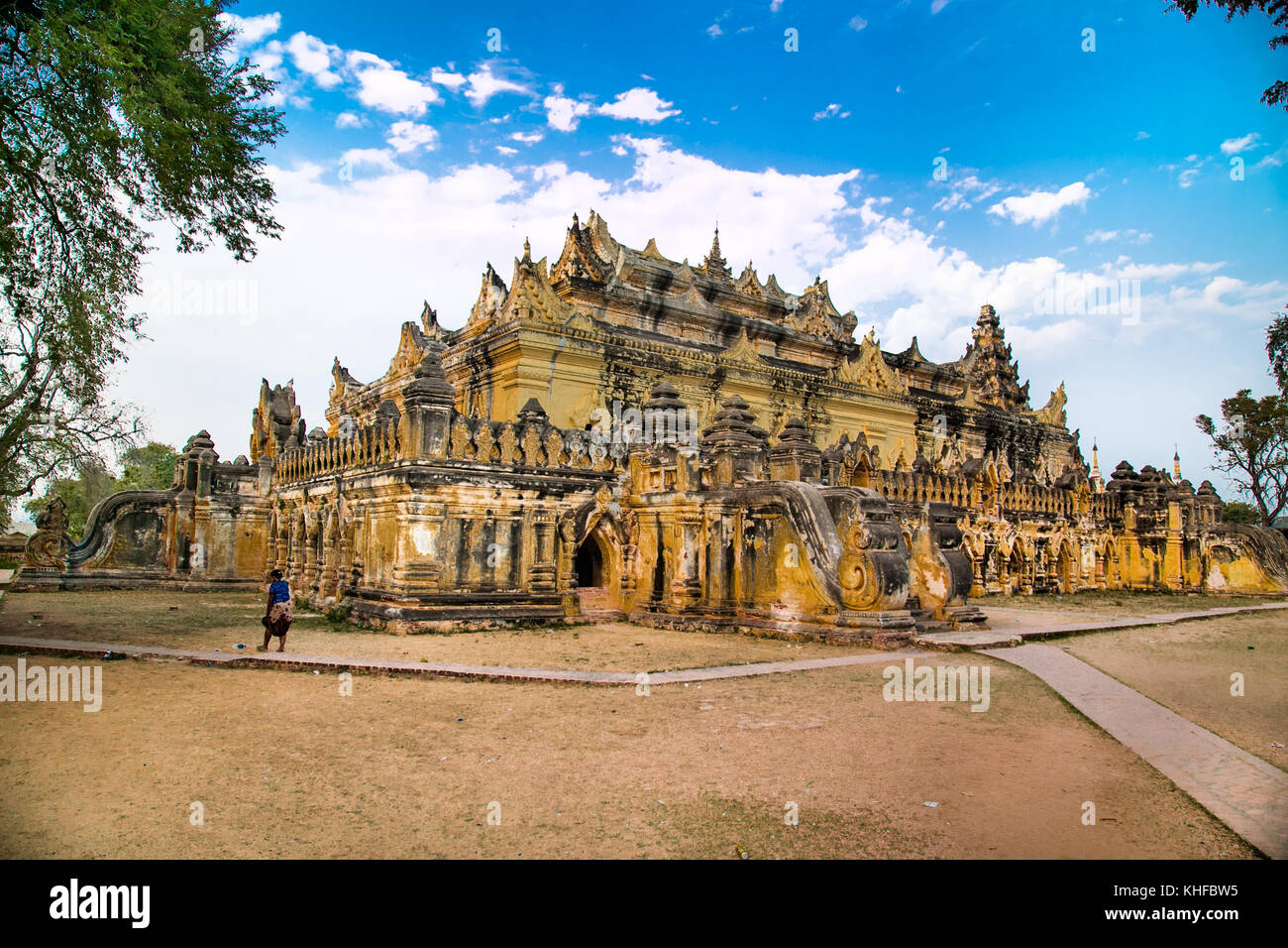 The brick yellow Maha Aung Mye Bon Zan monastery on the Inwa royal site ...
