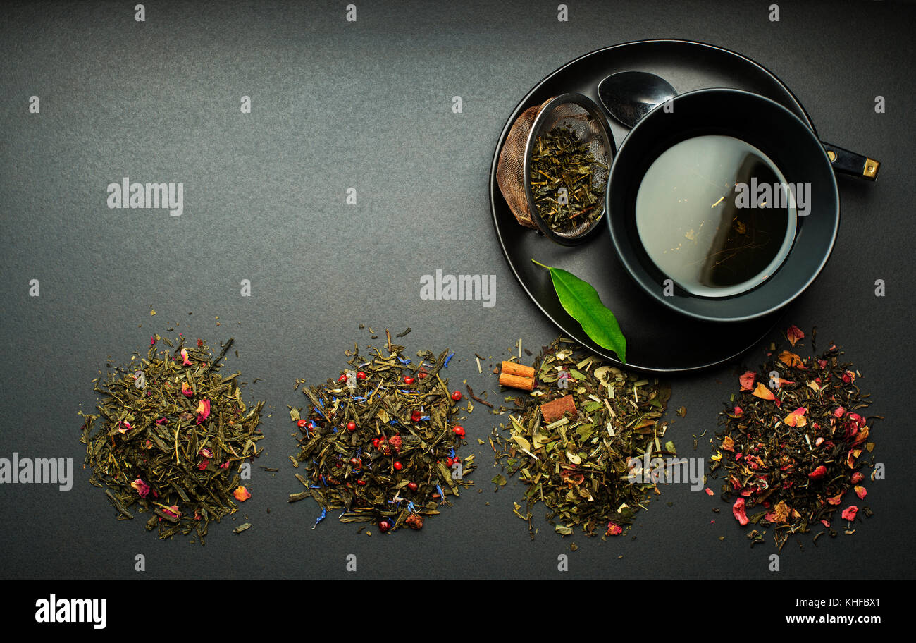 Cup of tea with dry tea collection of different types Stock Photo - Alamy