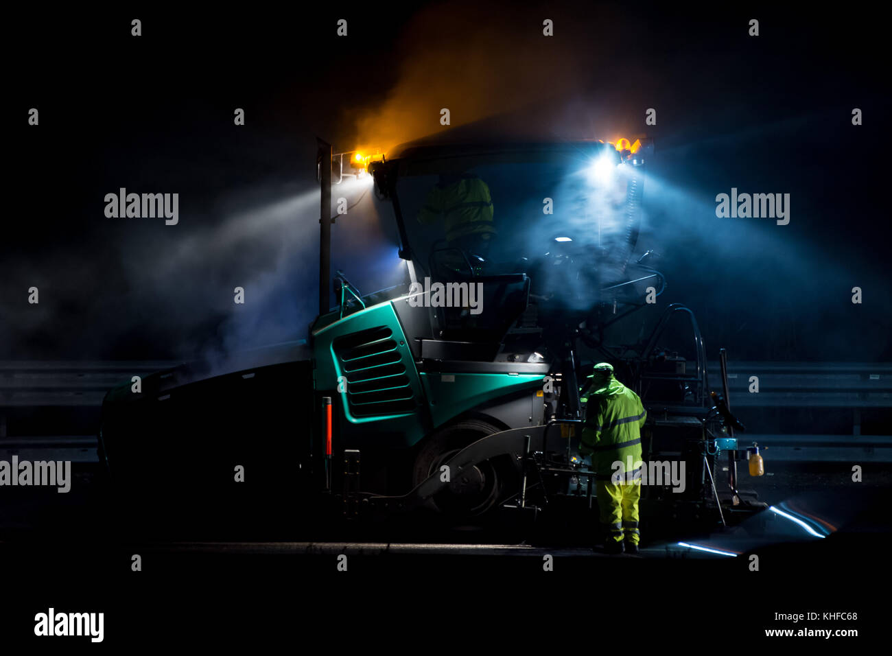 Man at work in motorway Stock Photo - Alamy