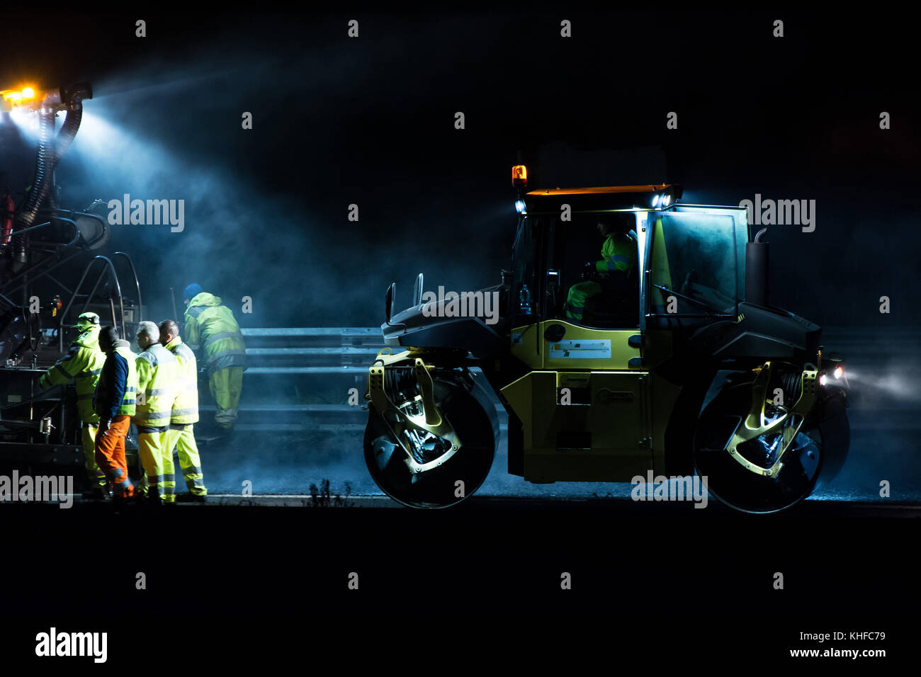 Man at work in motorway Stock Photo - Alamy