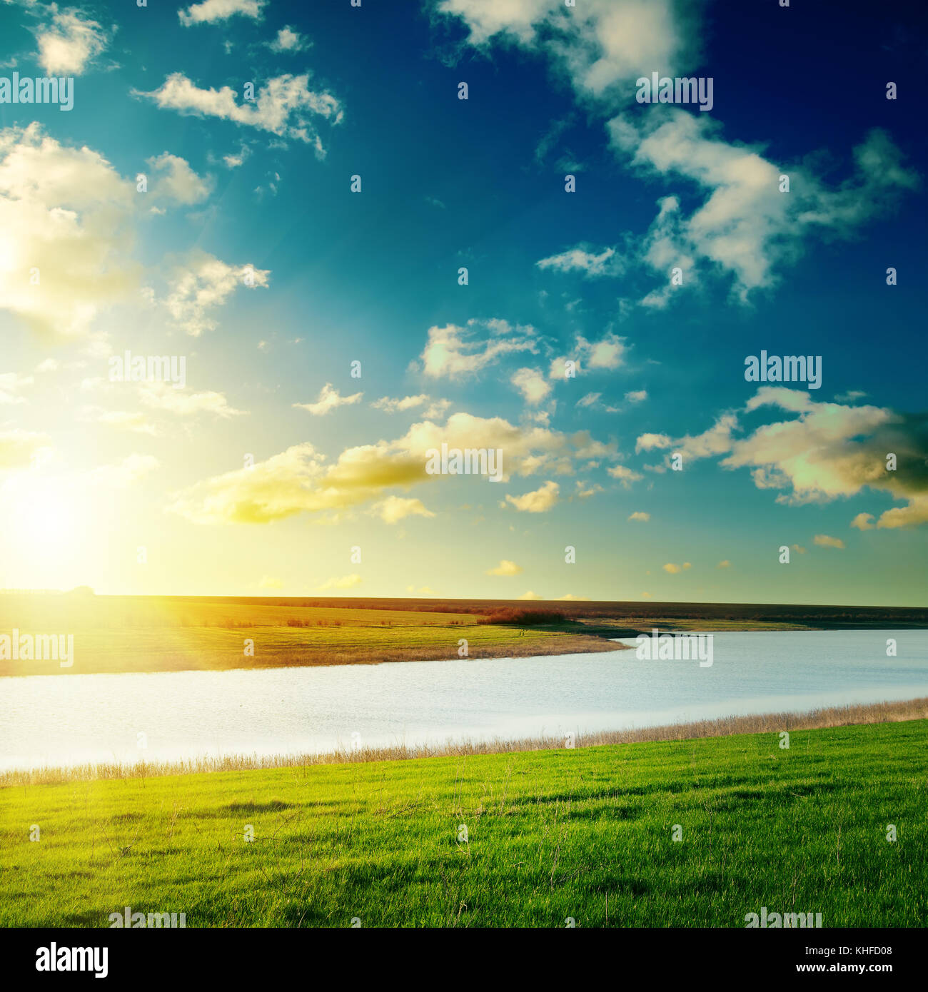 sunset over river Stock Photo - Alamy
