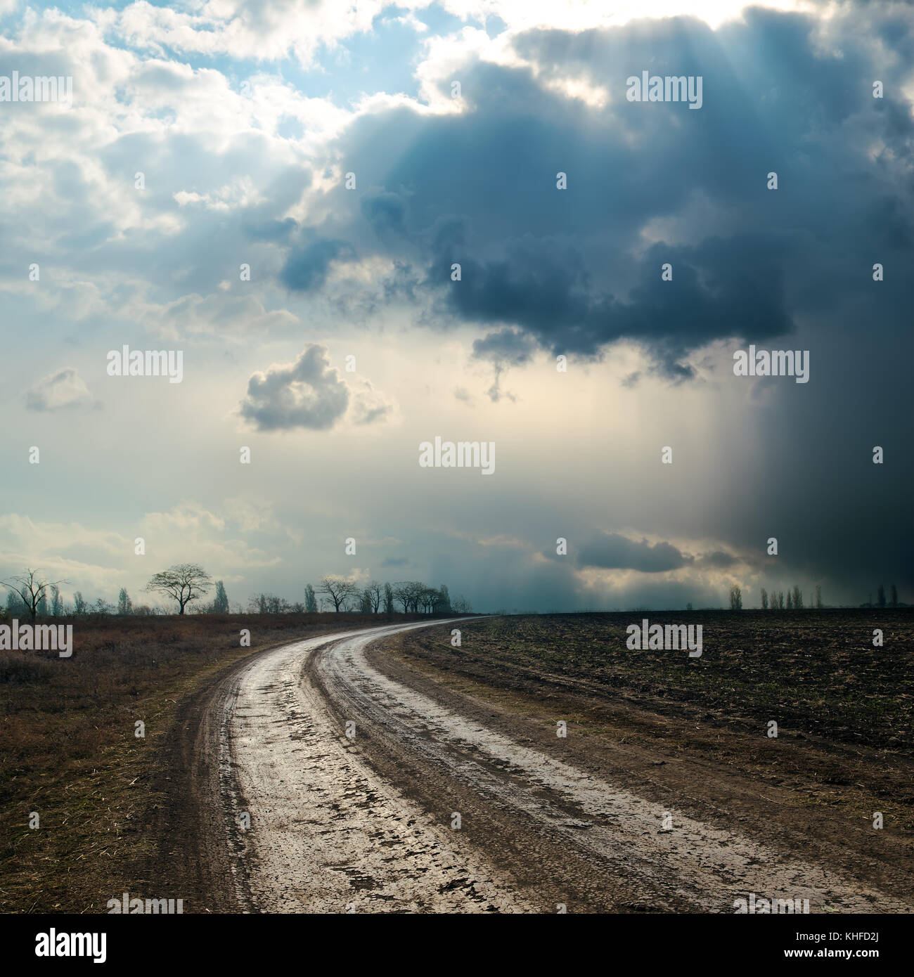 dirty road to dramatic sky Stock Photo - Alamy