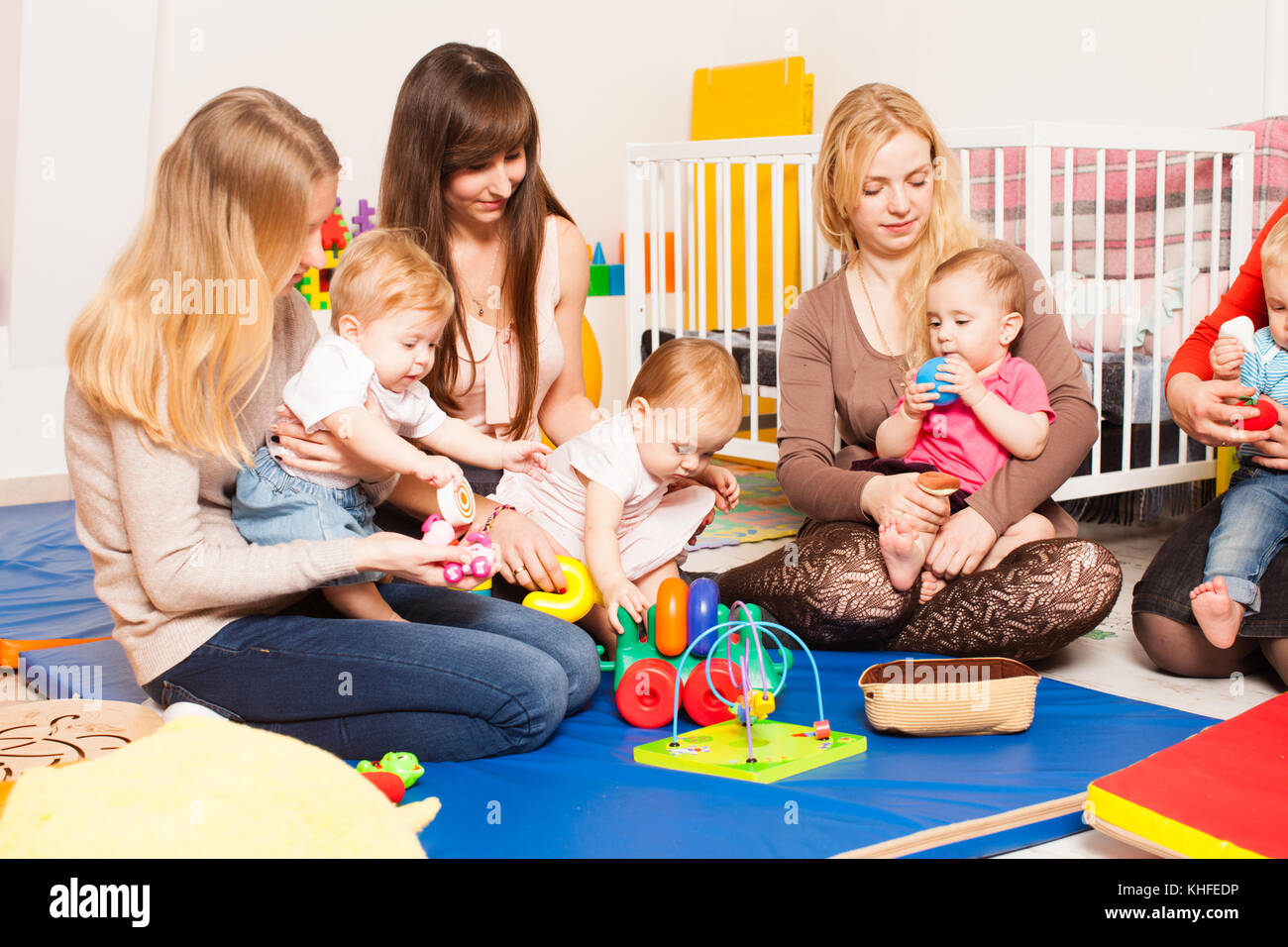 Group of mothers with their babies Stock Photo - Alamy