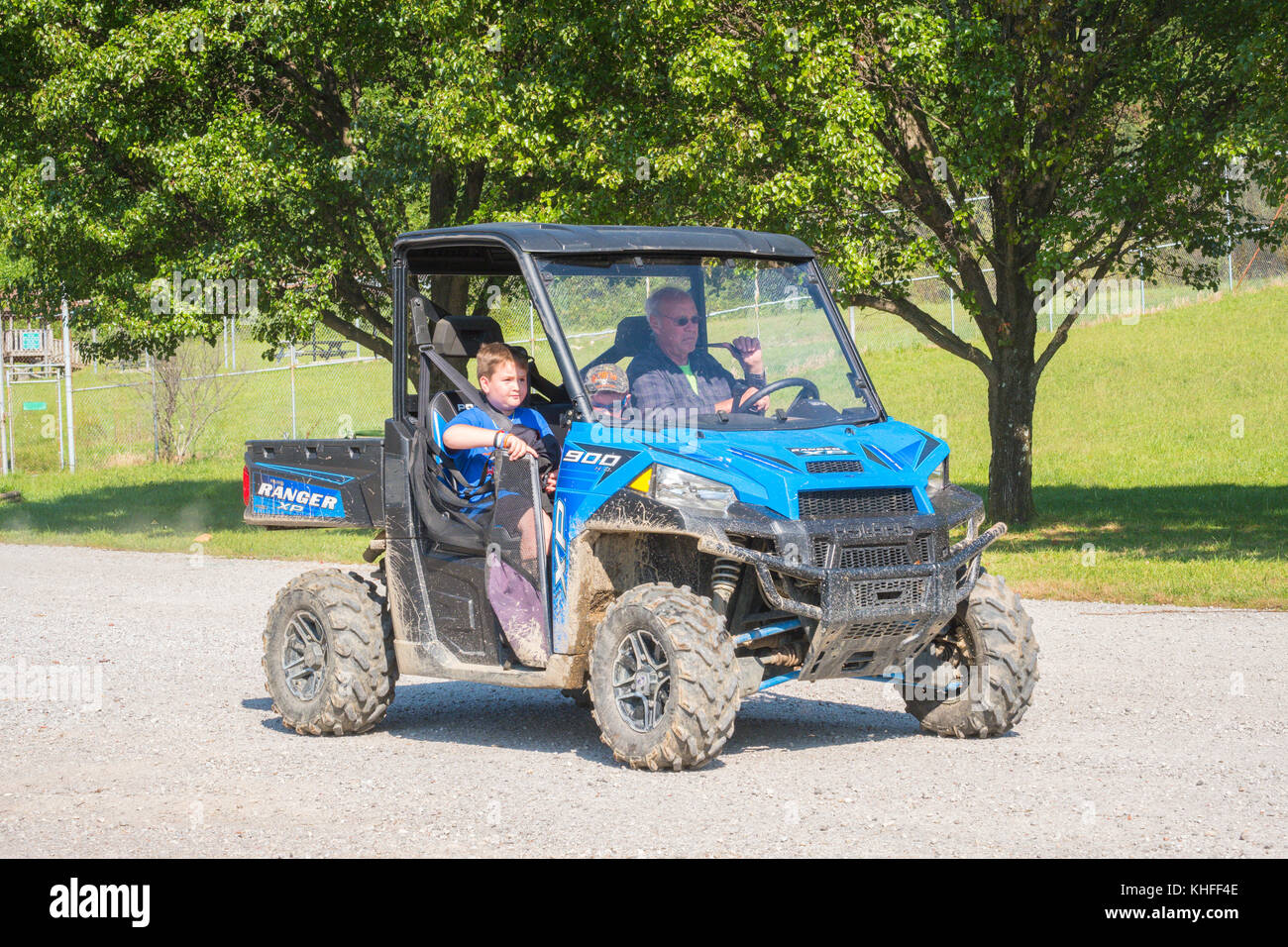 Family riding in off-road all-terrain 4 wheel ATV vehicle Stock Photo ...