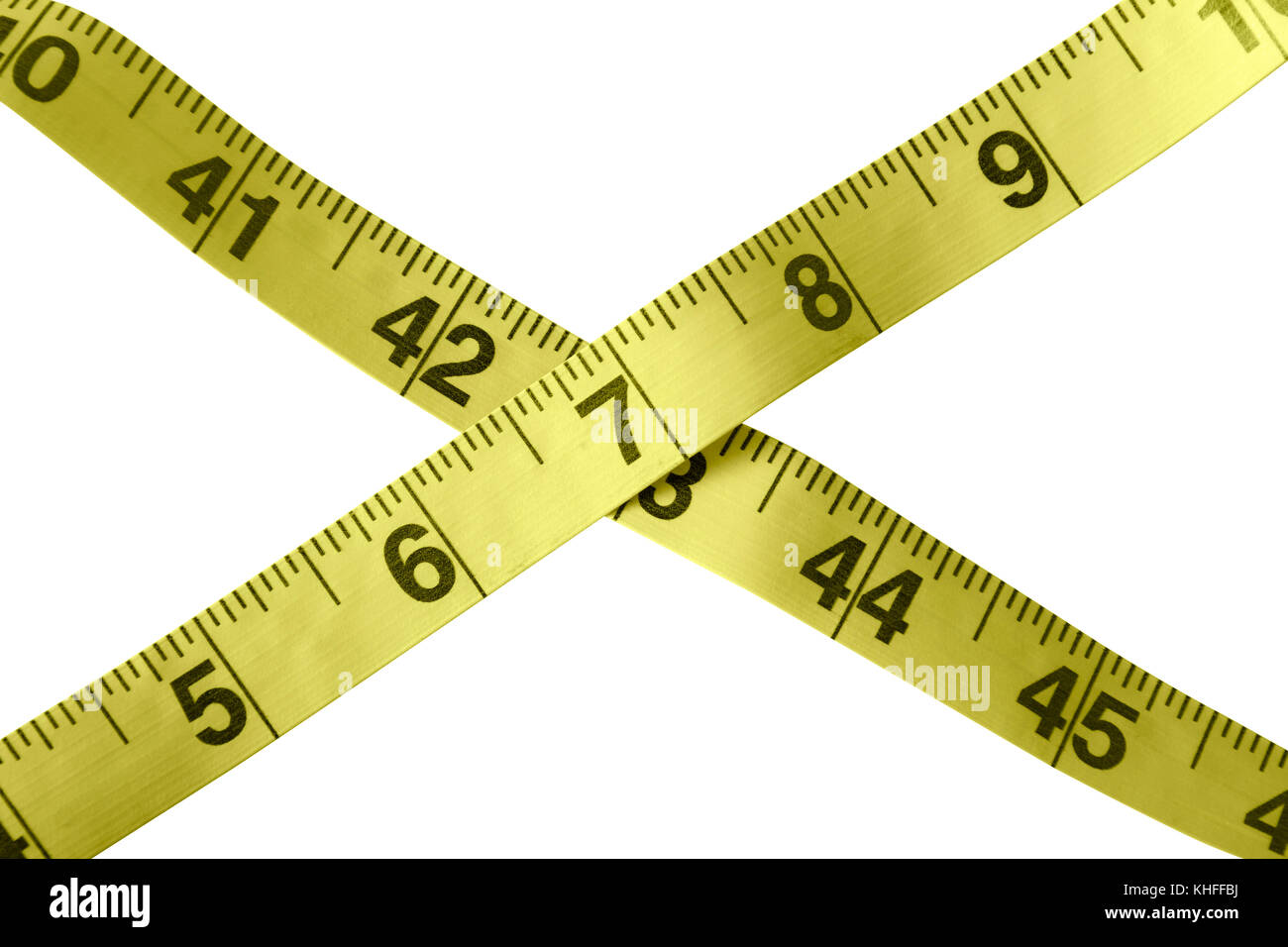 A measuring tape crossed over itself forming an 'X' Stock Photo - Alamy