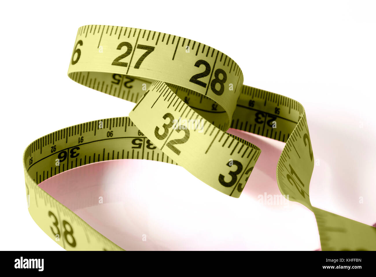 A yellow measuring tape with slight shadow and reflection Stock Photo ...