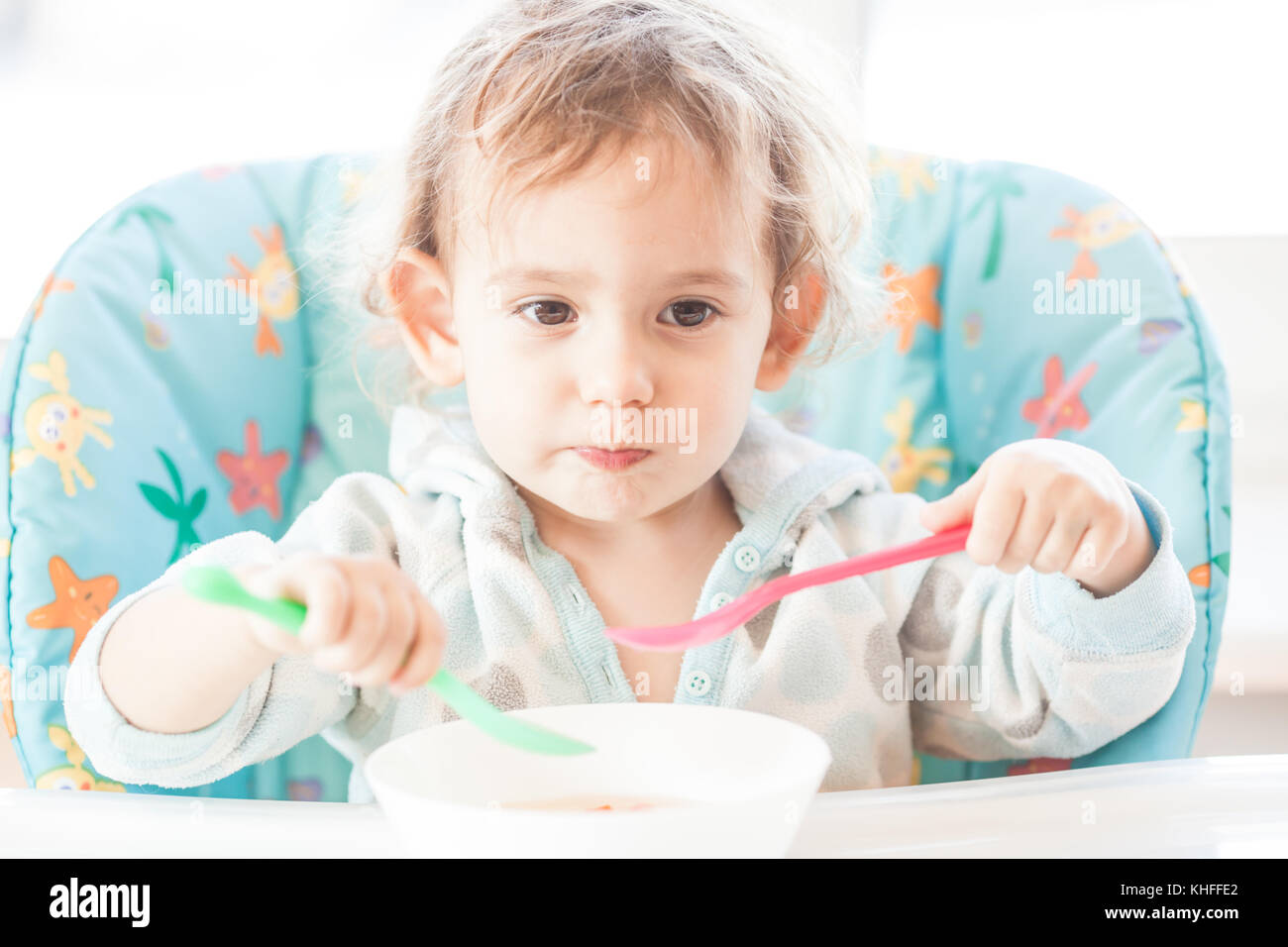 The girl is eating very fast Stock Photo - Alamy