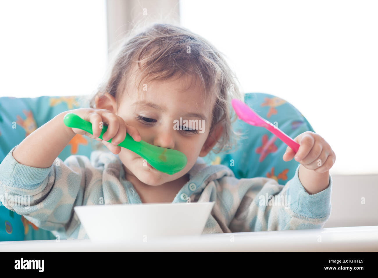 The girl is eating very fast Stock Photo - Alamy