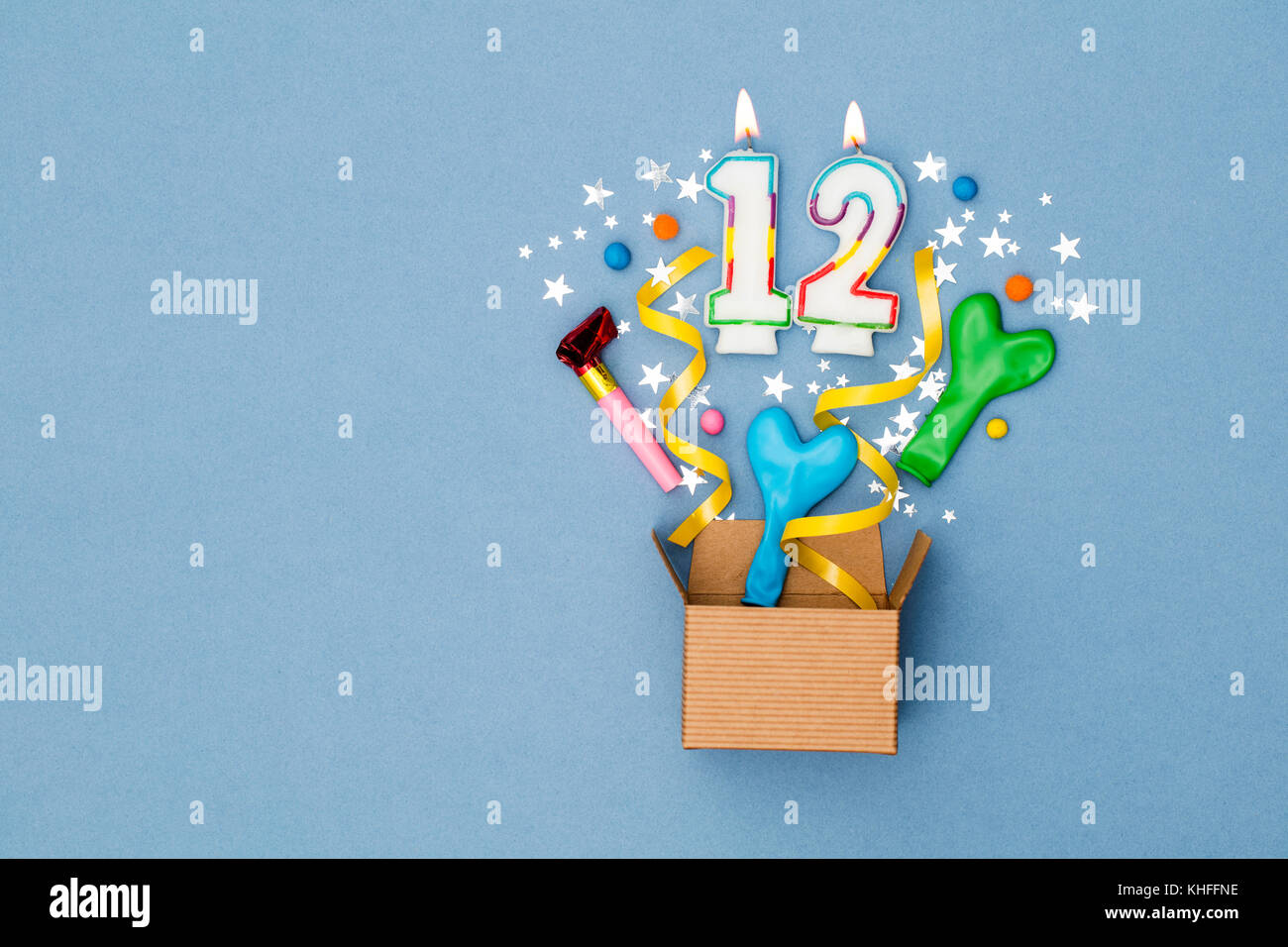 Number 12 celebration present background. Gift box exploding with party ...