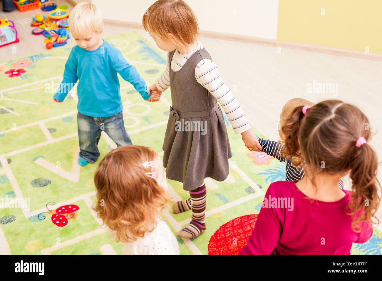 Group of little children dancing Stock Photo - Alamy