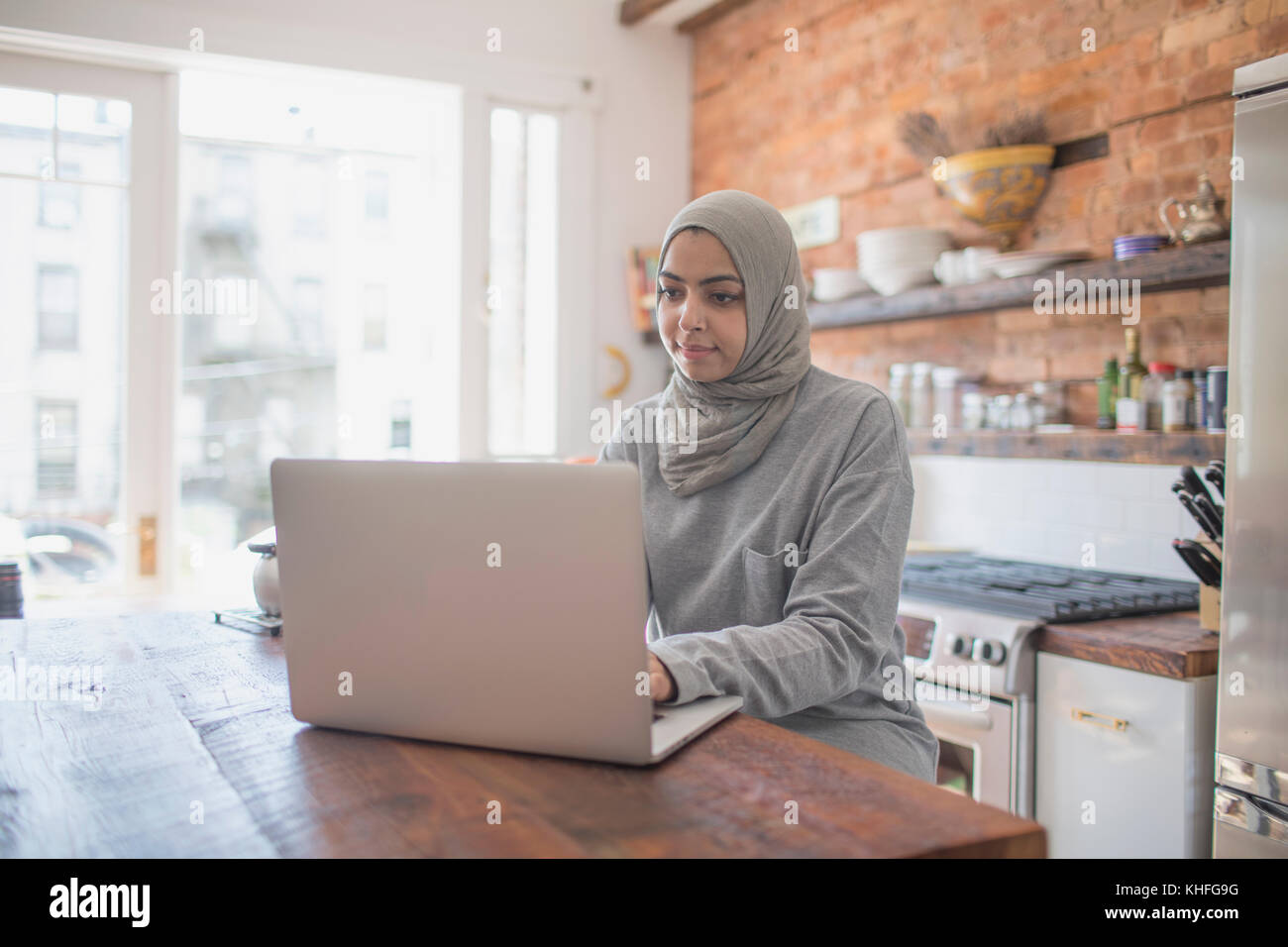 Muslim woman working home typing hi-res stock photography and images ...