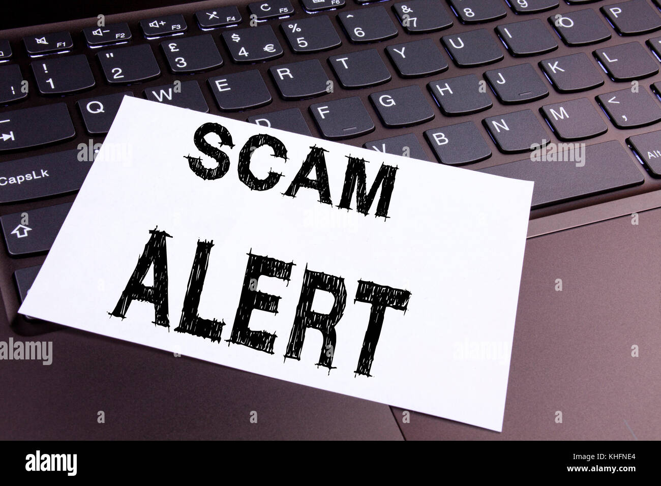 Scam Alert writing text made in the office close-up on laptop computer ...