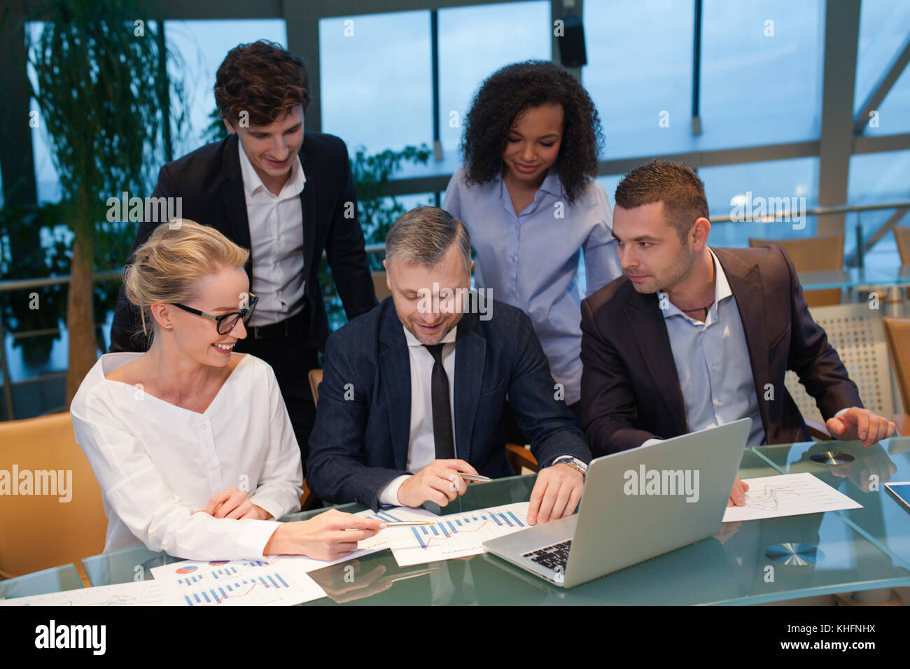Business people working as a team at the office Stock Photo - Alamy
